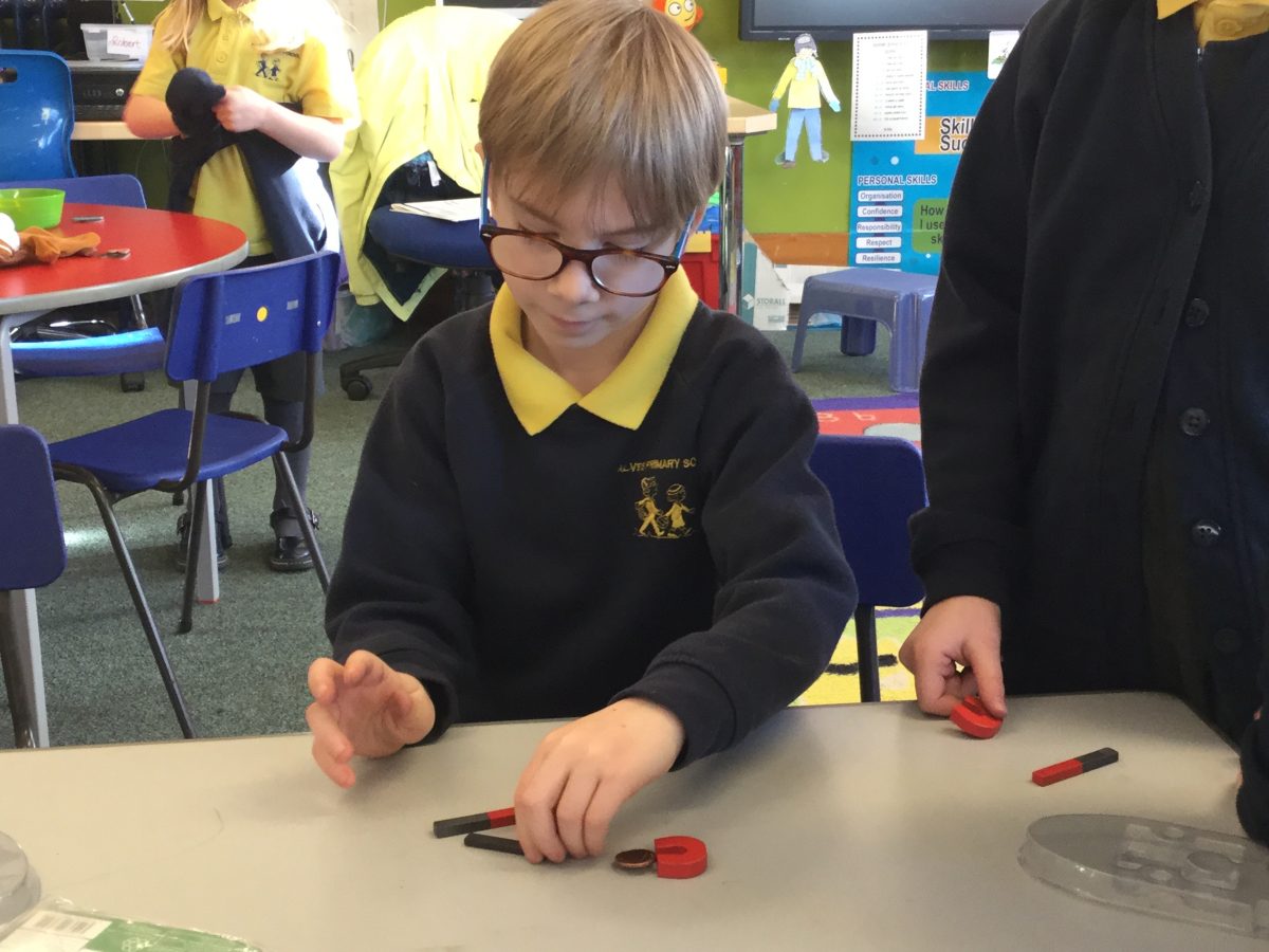 Learning about forces (push and pulls) while exploring magnets.